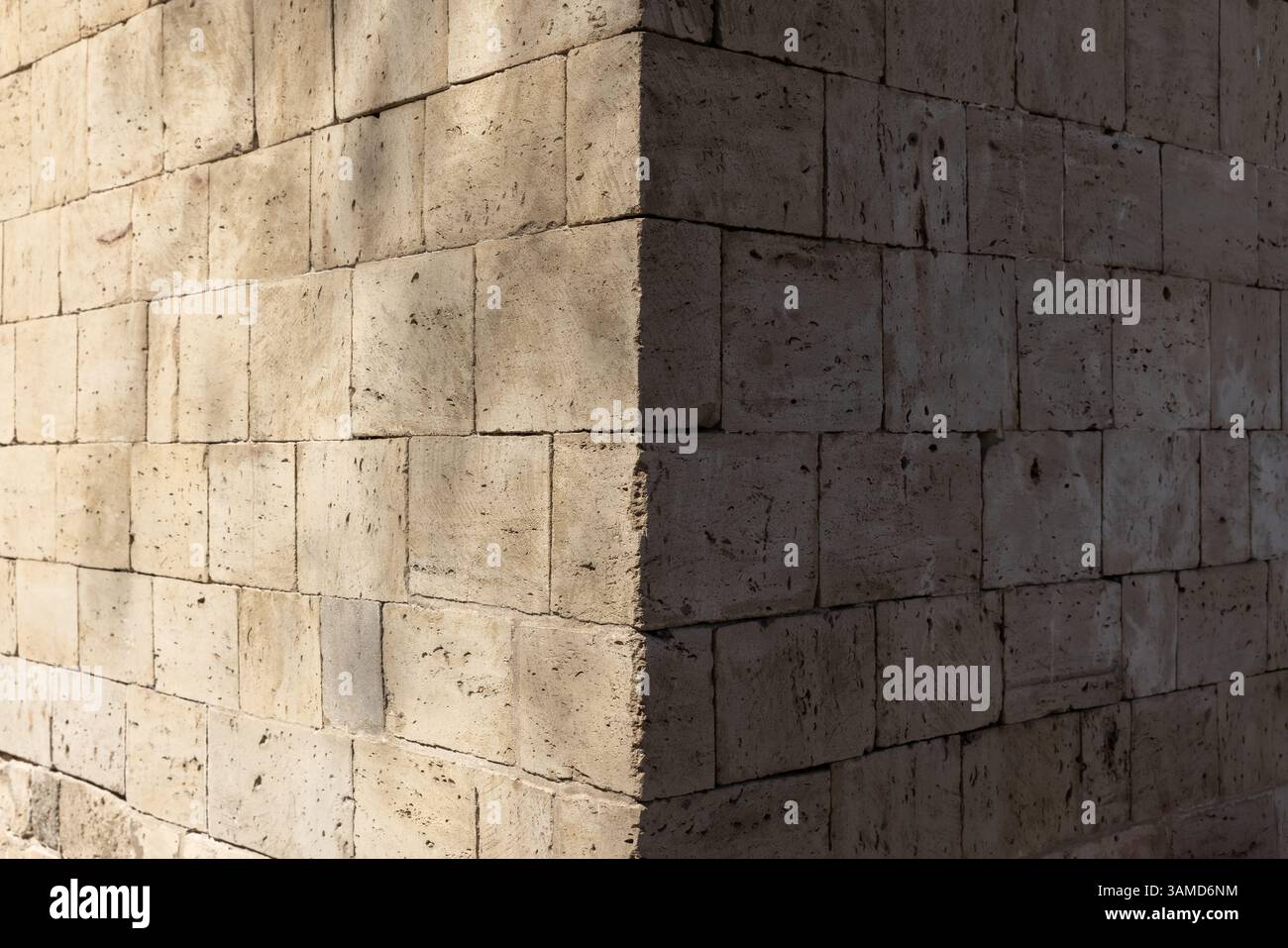 Photograph of the corner of a brick wall with stone blocks, showcasing ...