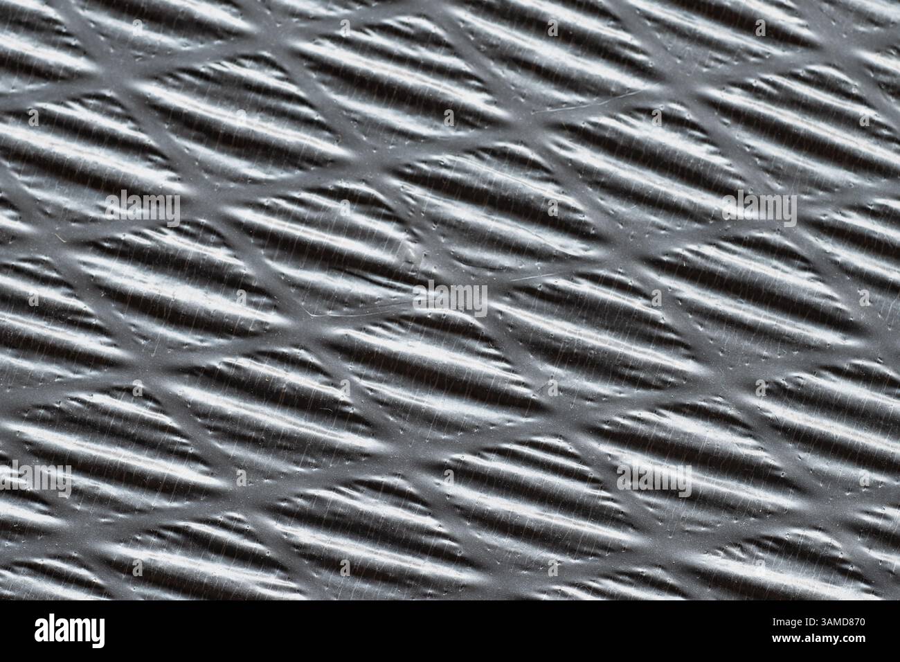 Grey foil with rhomboid pattern Stock Photo - Alamy
