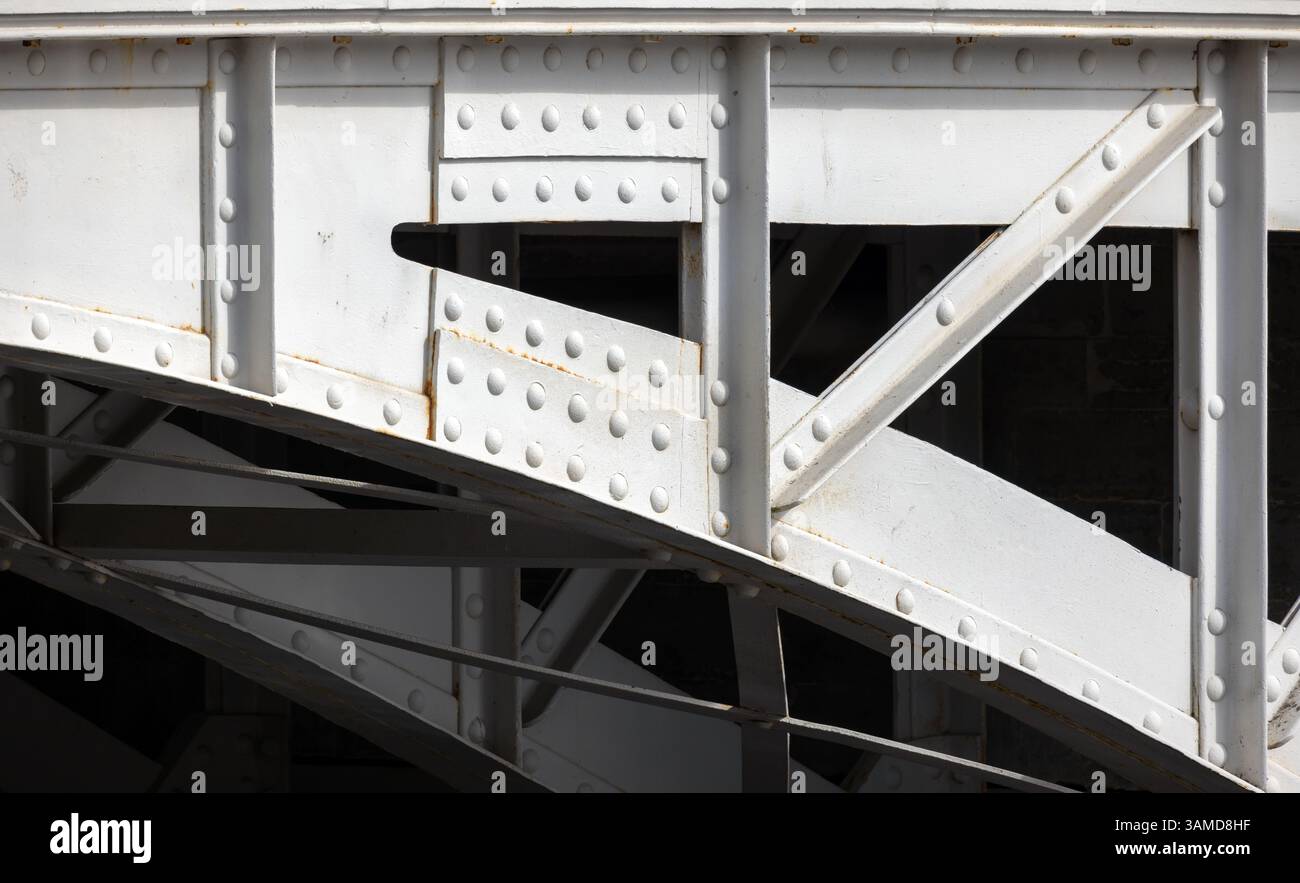Detailed image of a metal bridge structure, focusing on the rivets and ...