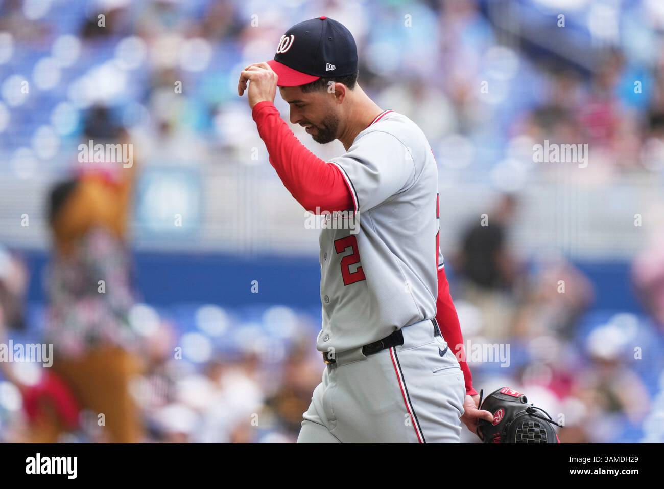 Washington Nationals relief pitcher Jorge Lopez walks to the dugout ...
