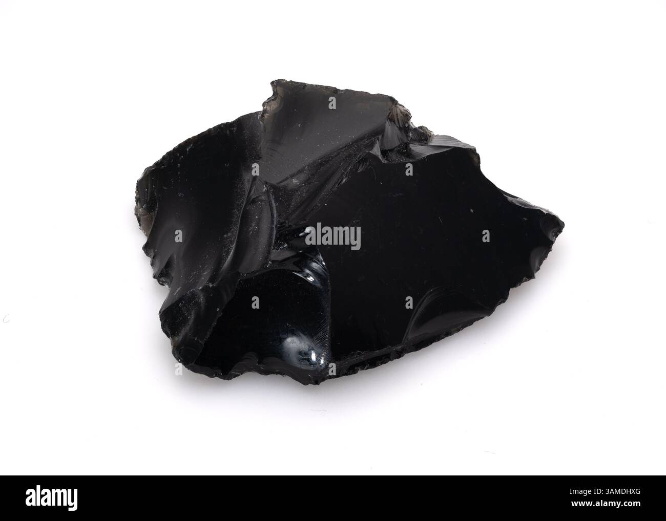 Glossy black obsidian rock isolated on white background Stock Photo - Alamy