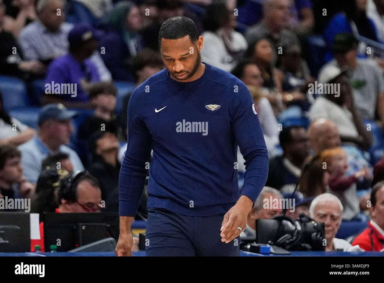 New Orleans Pelicans head coach Willie Green walks on the court during ...
