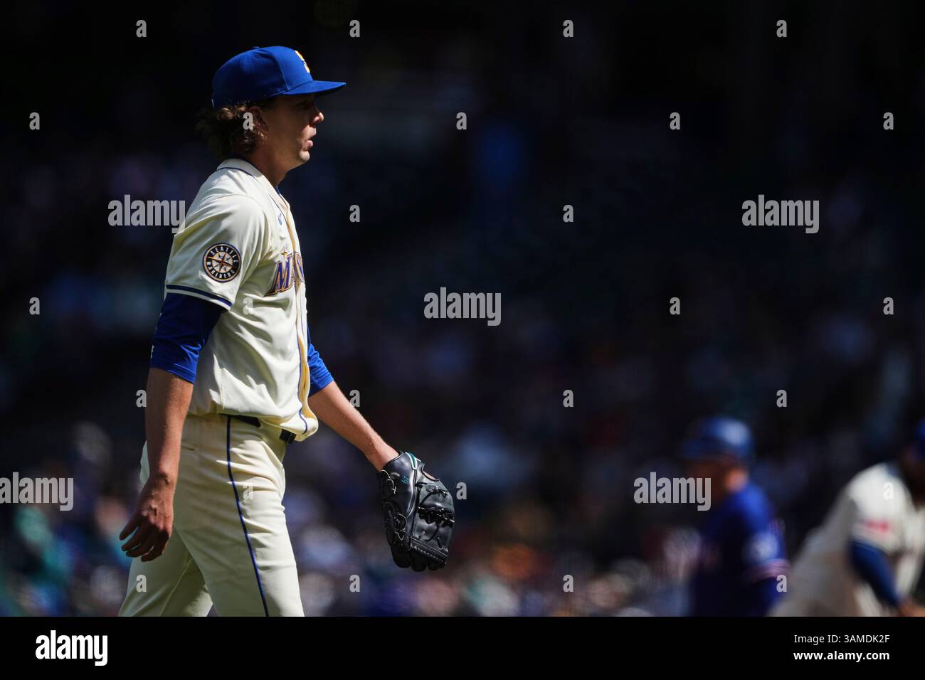 Seattle Mariners starting pitcher Logan Gilbert walks back to the ...