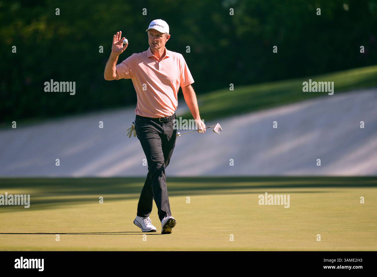 Justin Rose reacts after missing an eagle putt on the 13th hole during ...