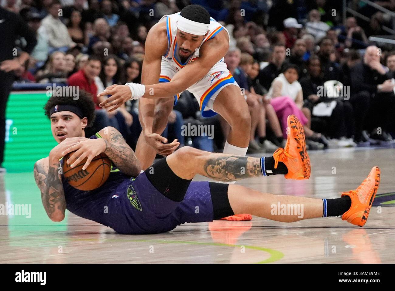 New Orleans Pelicans guard Lester Quinones battles for a loose ball ...