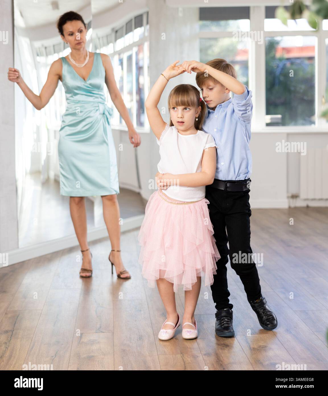 Preteen girl and boy practicing samba in latin dance studio Stock Photo ...