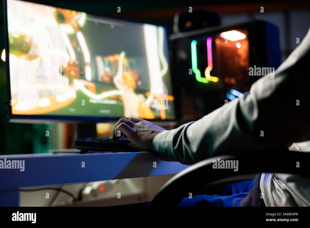 Guy playing first person shooter videogame with automatic gun shooting ...