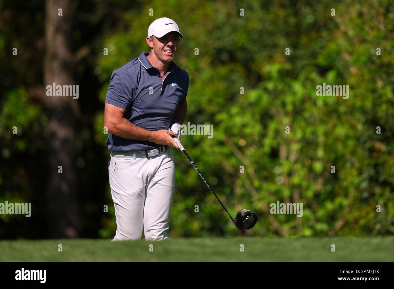 Rory McIlroy, of Northern Ireland, watches his tee shot on the 11th ...