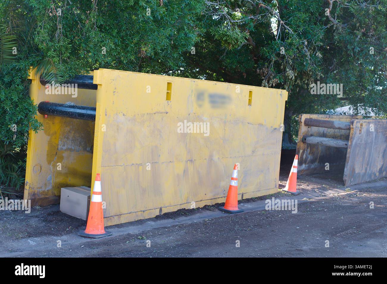 Trench Shield Construction Barrier with Orange Traffic Cones on a ...