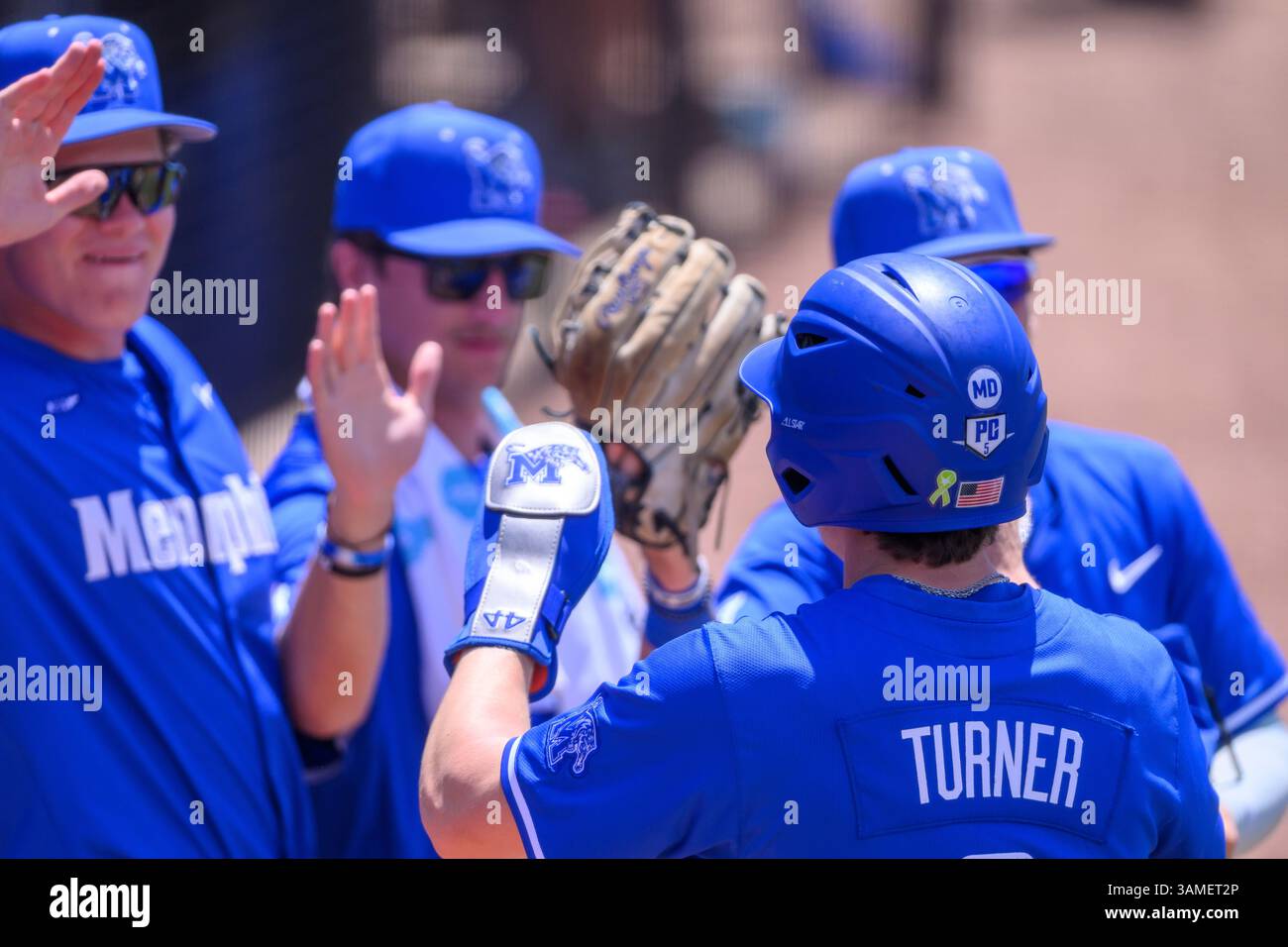 Memphis infielder Cy Turner (9) celebrates scoring a run with teammates ...
