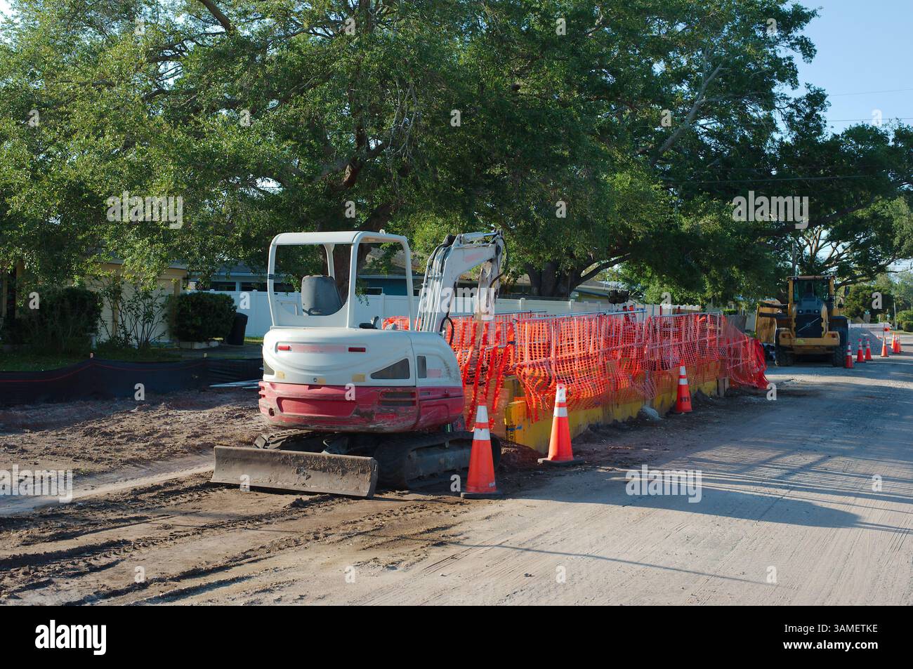 Road Construction Trench repair Site with Orange Barriers and Safety ...