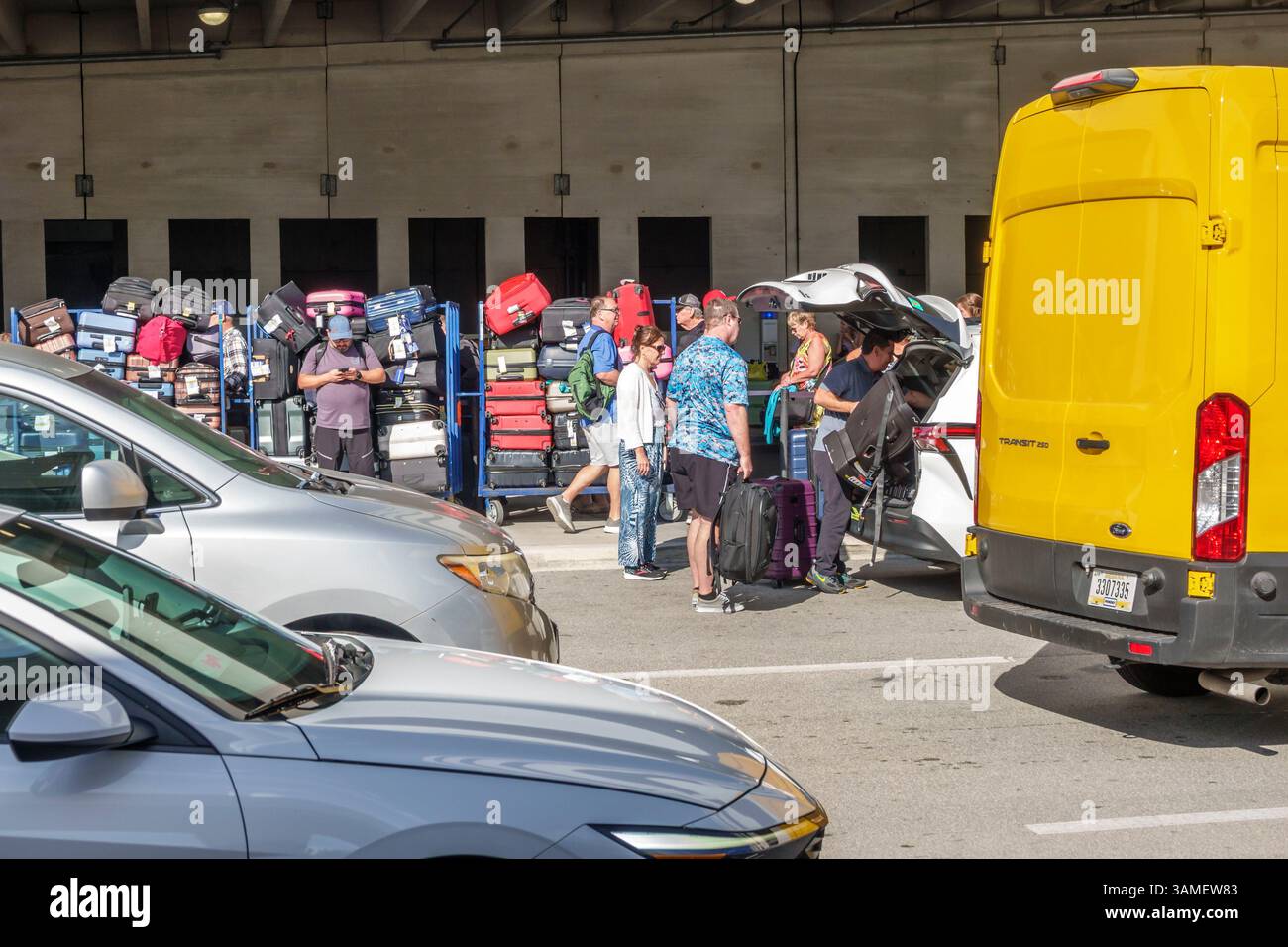 Passengers pick up suitcases hi-res stock photography and images - Alamy