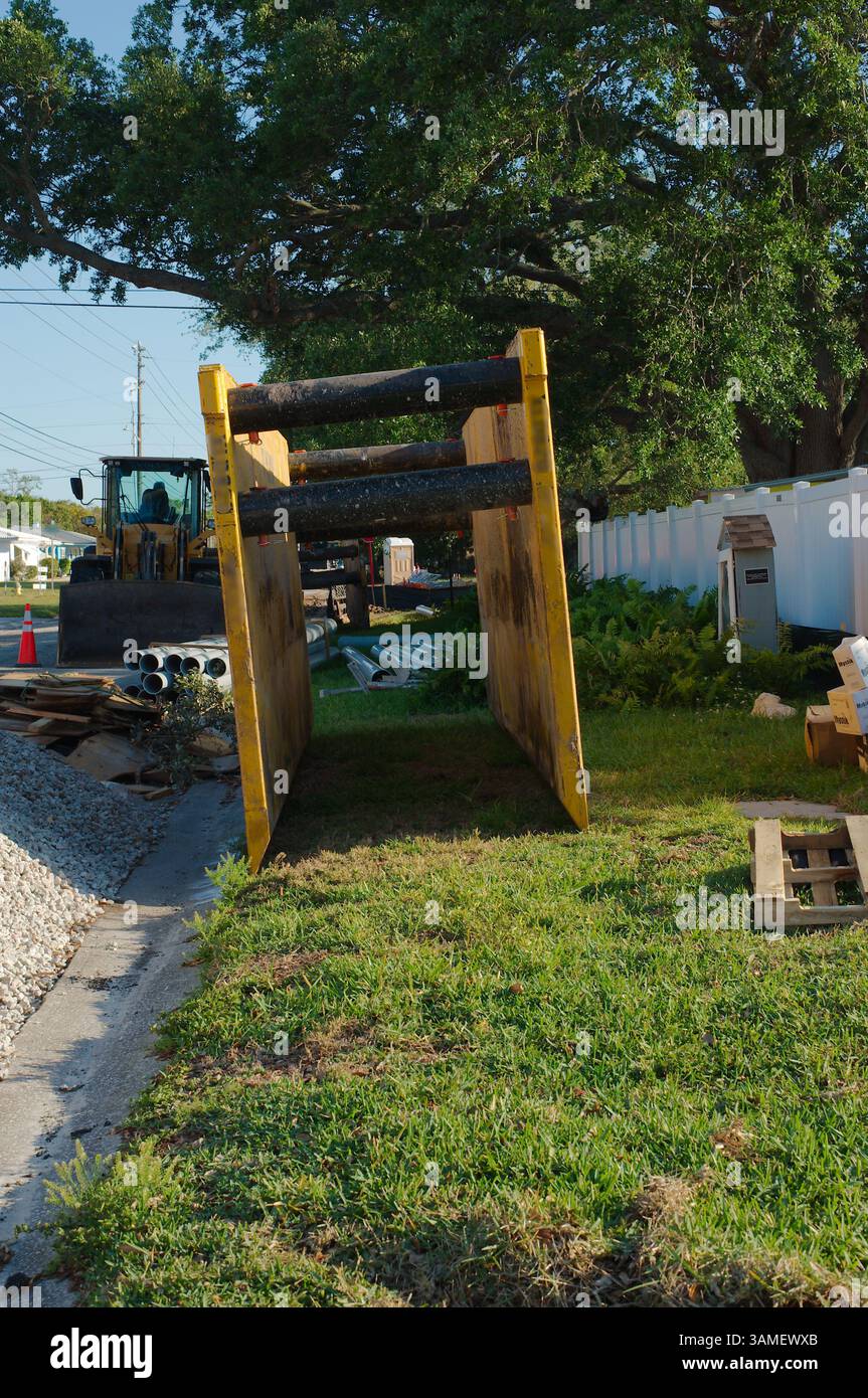 Trench Shield Construction Barrier with Orange Traffic Cones on a ...