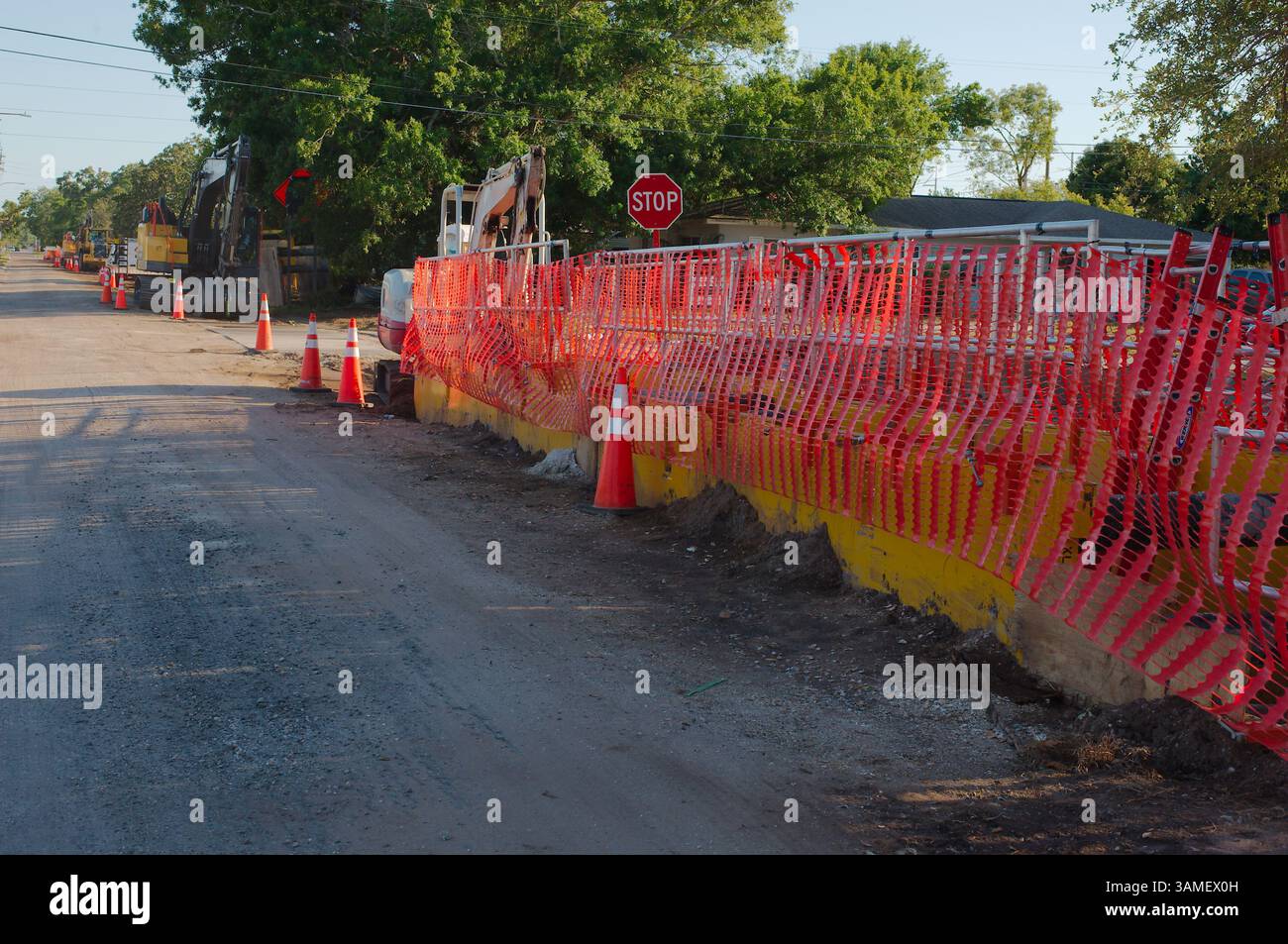Road Construction Trench repair Site with Orange Barriers and Safety ...