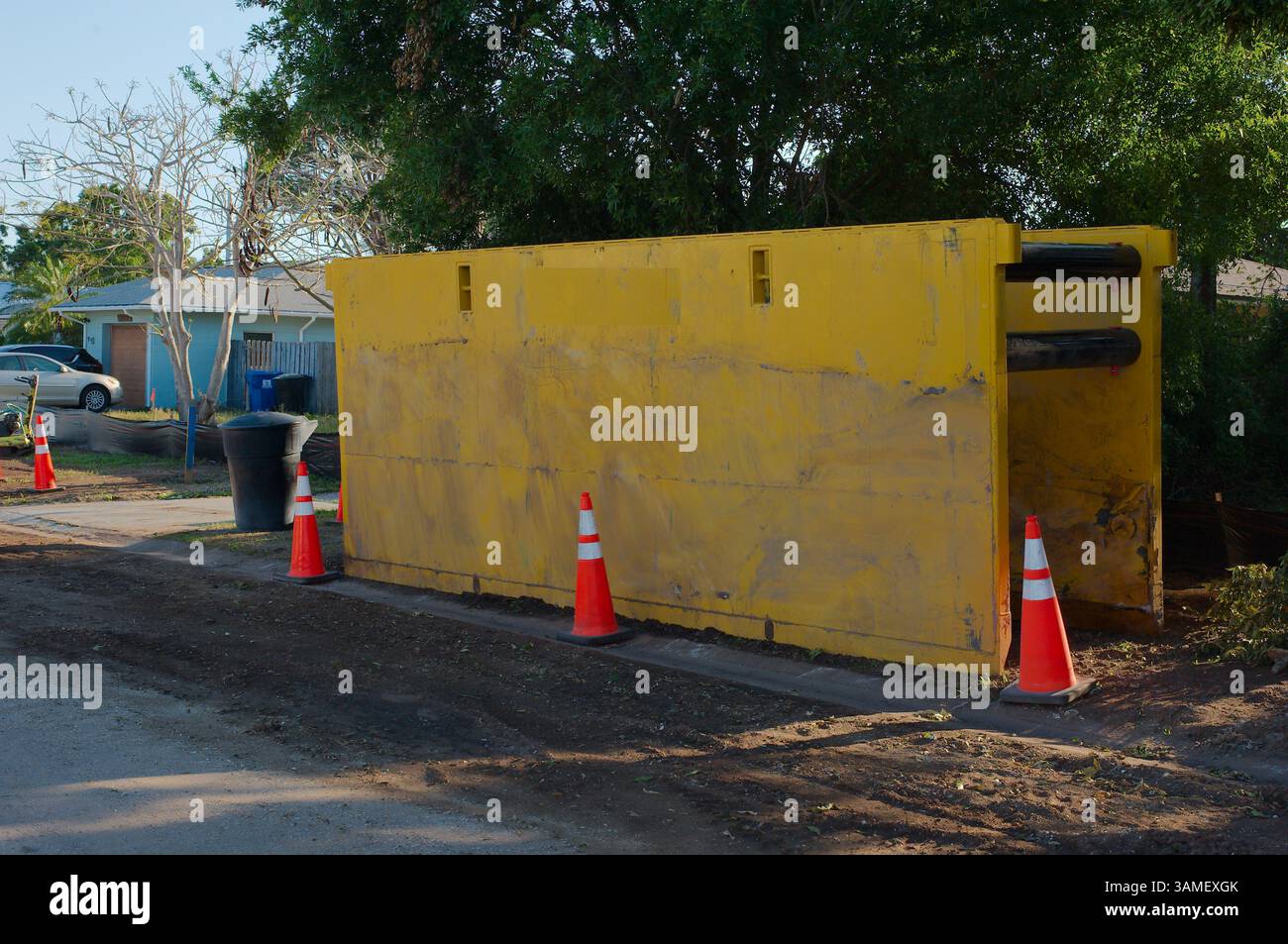 Trench Shield Construction Barrier with Orange Traffic Cones on a ...