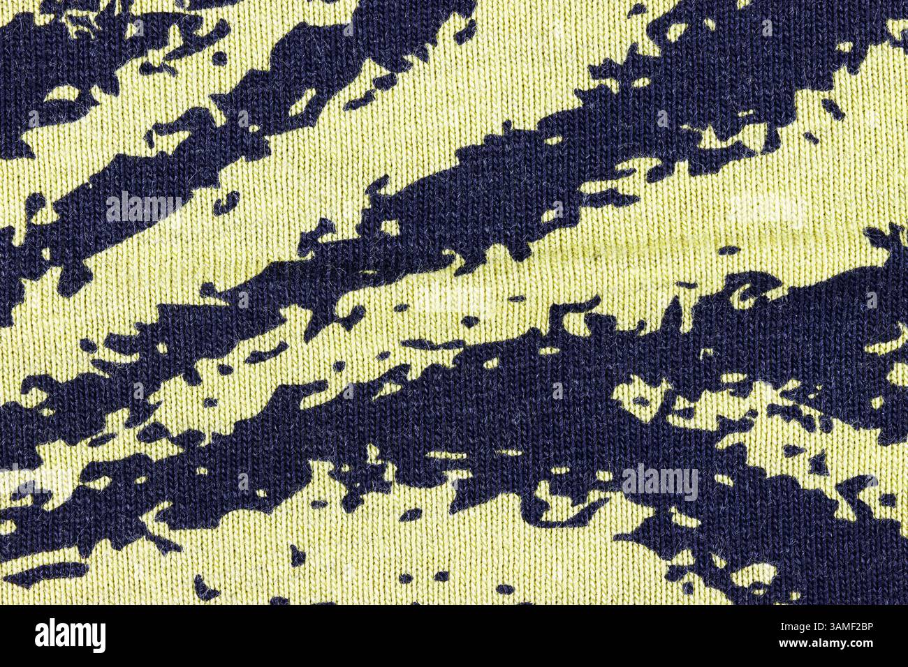 Abstract blue and yellow pattern on fabric with rough texture Stock ...