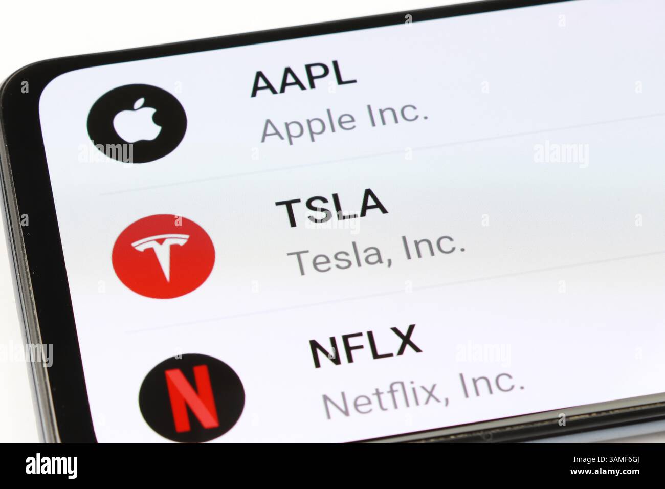 Tech giants logos on smartphone screen featuring apple tesla and ...
