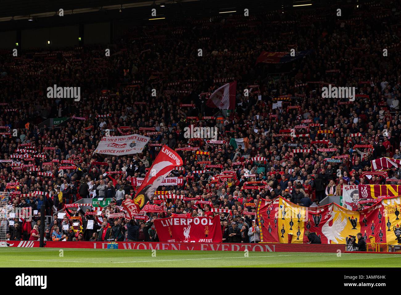 The Kop at Liverpool display banners remembering the 97 Liverpool ...