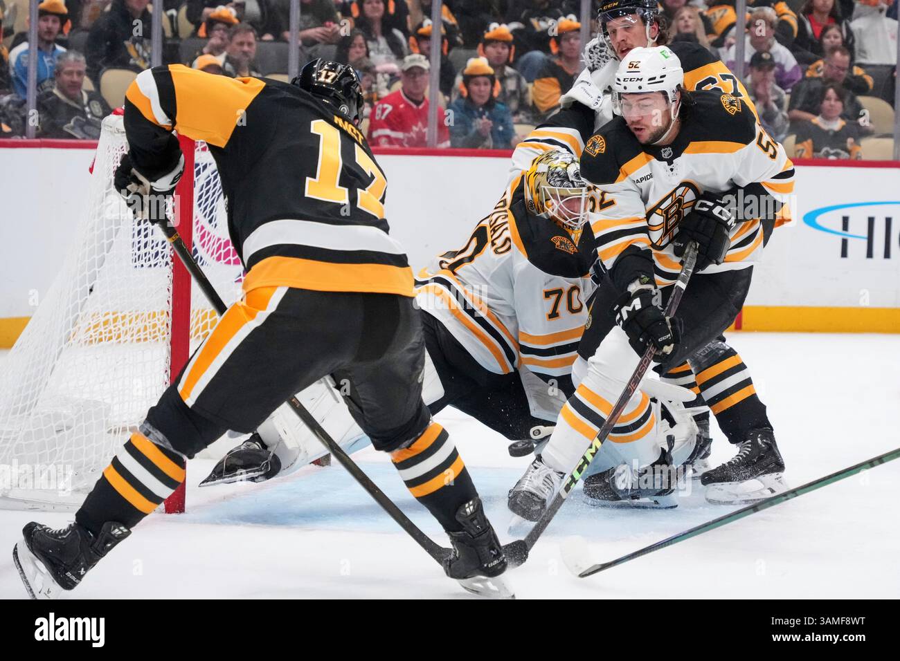 Pittsburgh Penguins' Bryan Rust (17) is defended by Boston Bruins ...