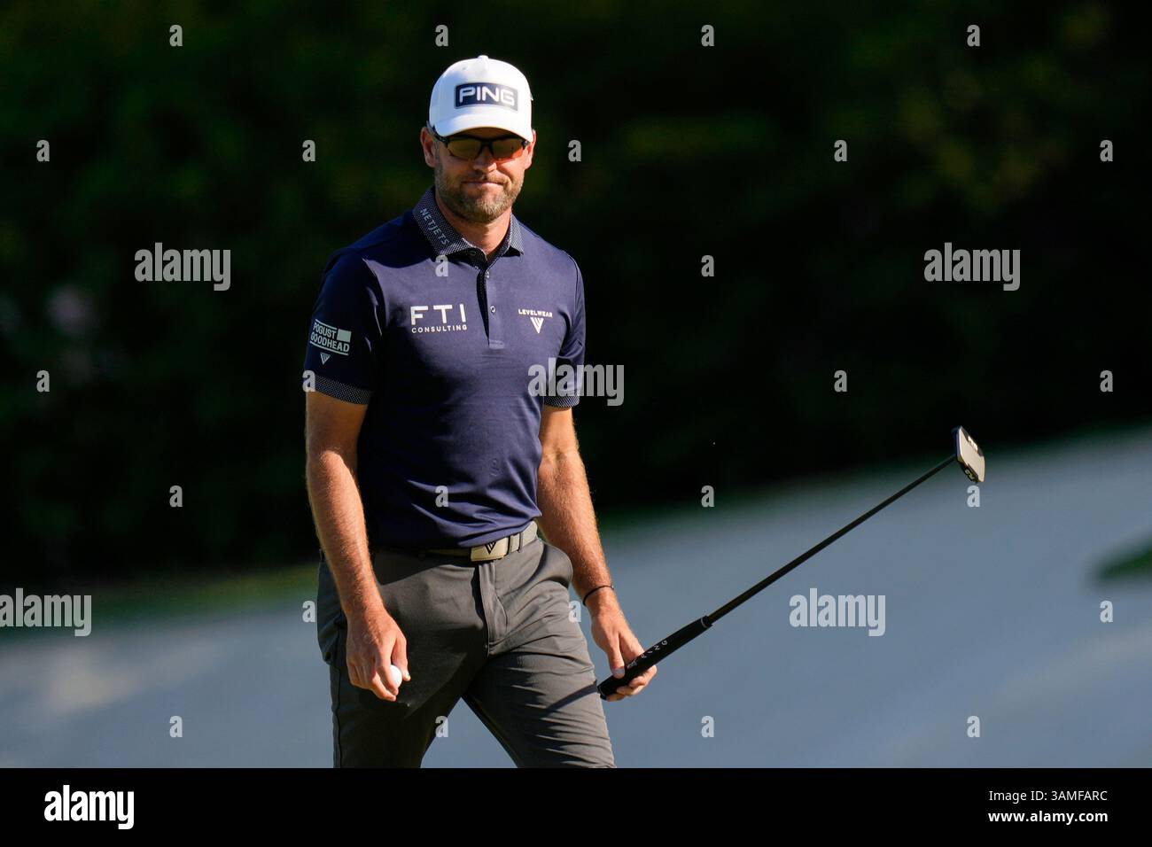 Corey Conners, of Canada, walks off the green on the 13th hole during ...