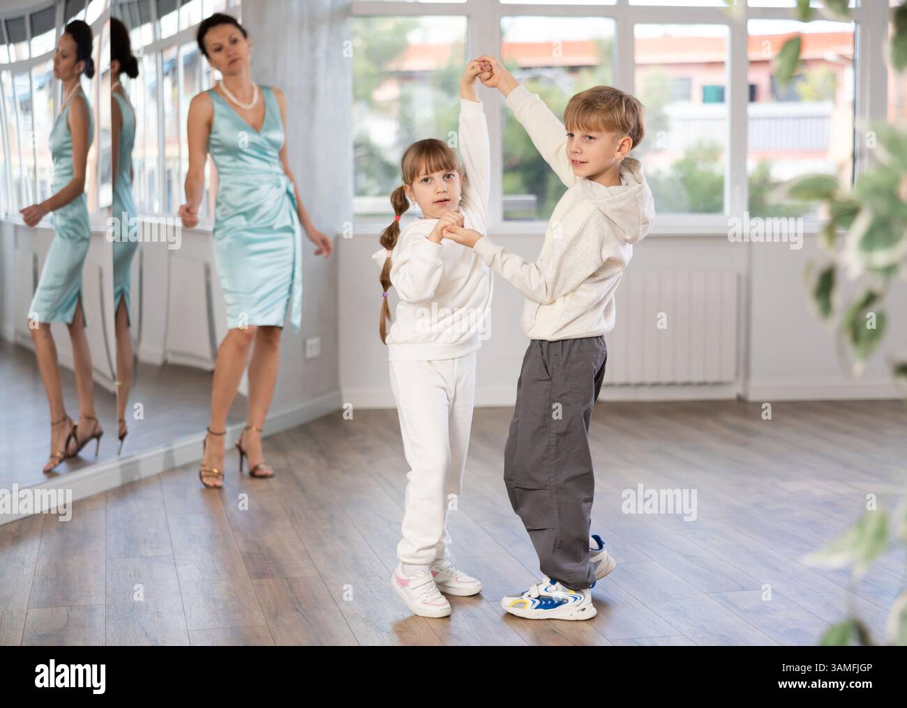 Tween dancers, girl and boy practicing waltz in dance studio Stock ...