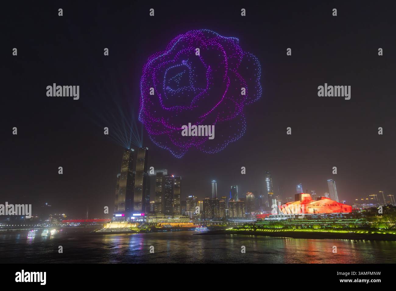 CHONGQING, CHINA - APRIL 12, 2025 - Tourists watch a drone light show ...