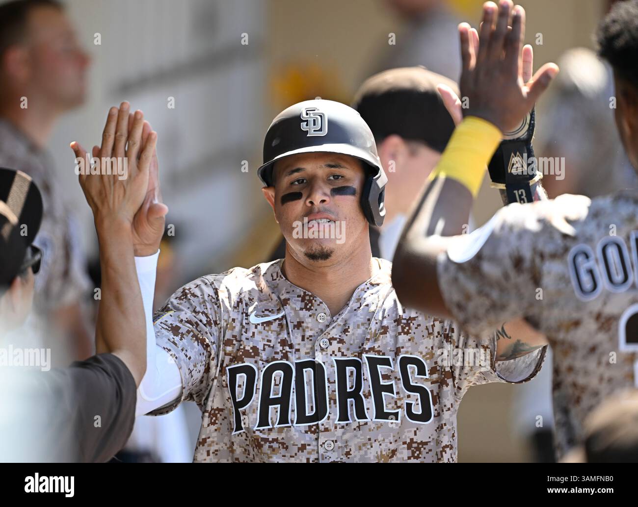 San Diego Padres' Manny Machado (13) is congratulated after hitting a ...
