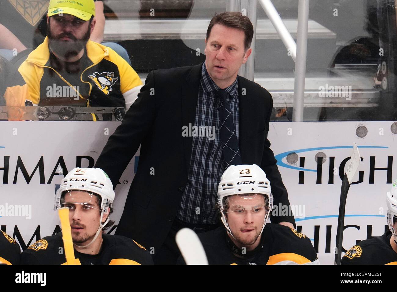 Boston Bruins interim head coach Joe Sacco stands behind his bench ...