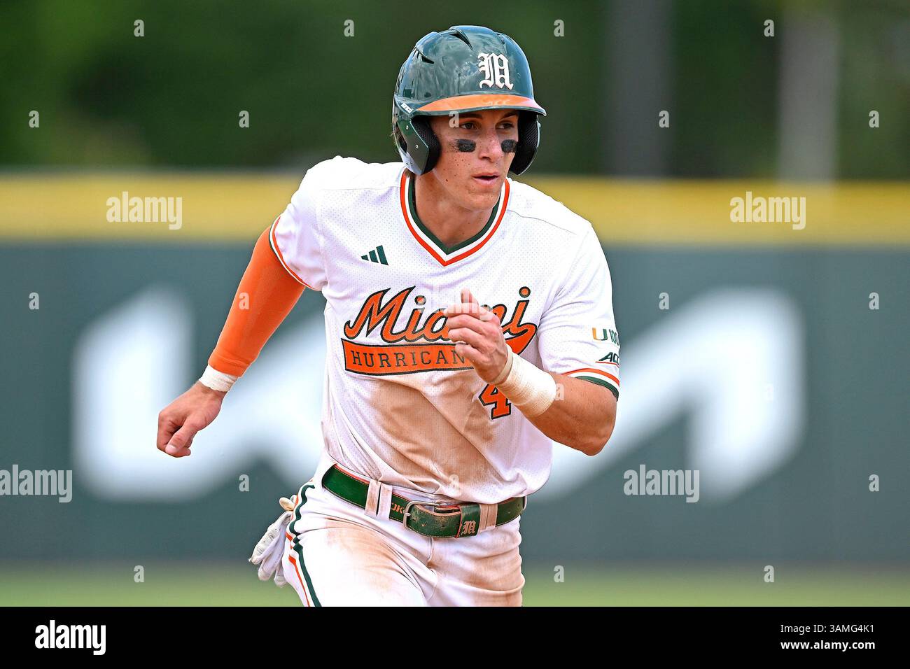 CORAL GABLES, FL - APRIL 13: Miami infielder Jake Ogden (4) runs to ...