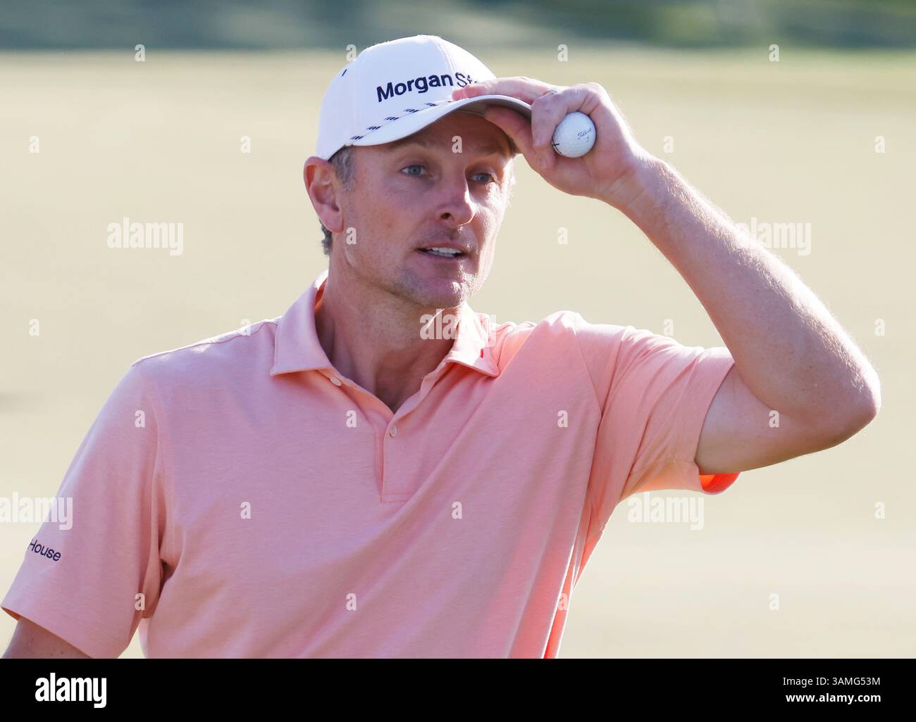 Justin Rose of England tips his cap as he walks off the 18th green ...