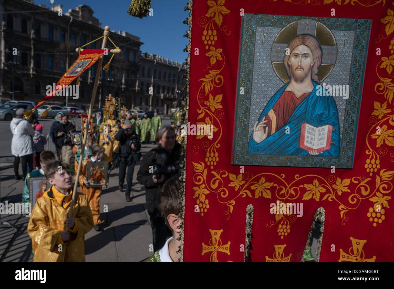 Banner bearers carry banners bearing the image of Christ during the ...