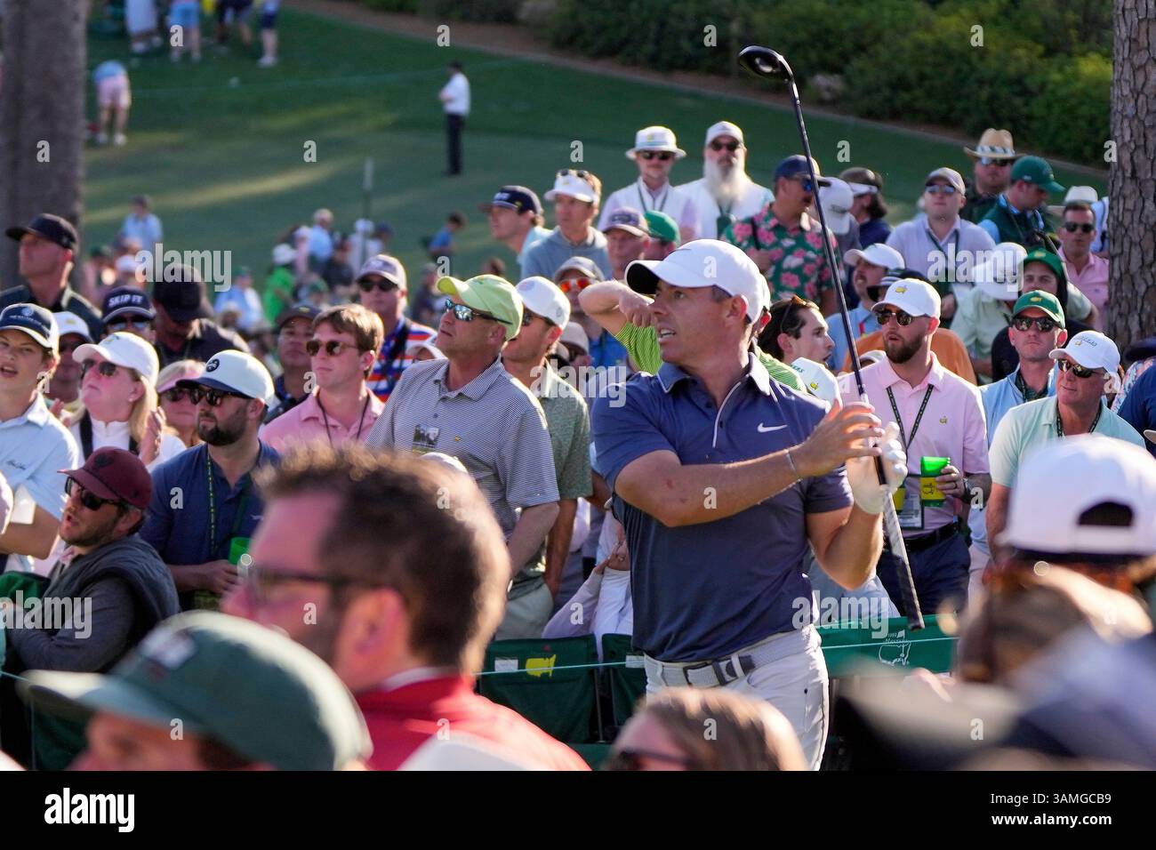 Rory McIlroy, of Northern Ireland, watches his tee shot on the 17th ...