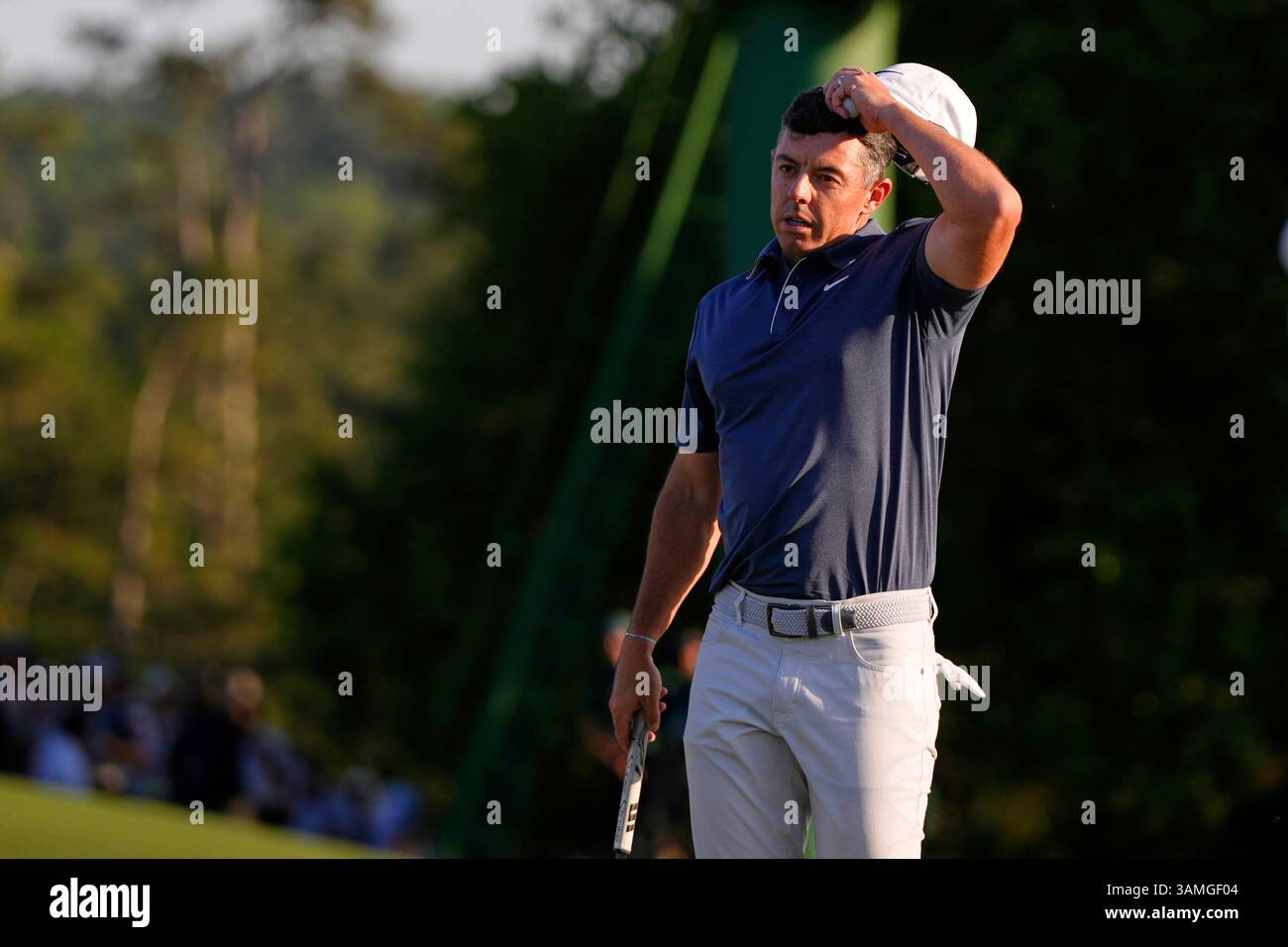 Rory McIlroy, of Northern Ireland, reacts after a bogey on the 18th ...