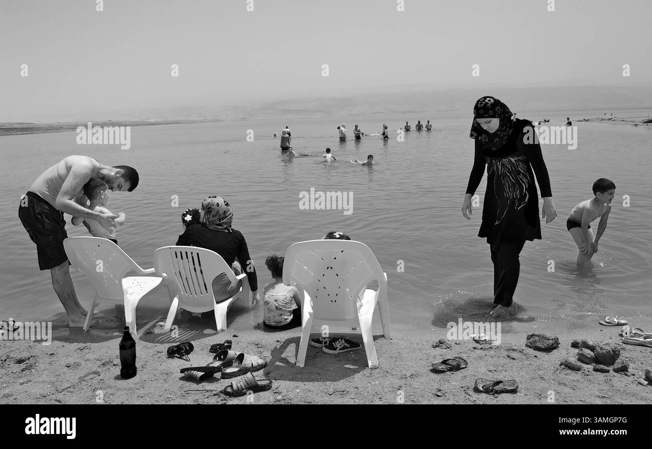 May 3, 2012 - Dead Sea, Israel - Arab Family enjoying the mud in the ...