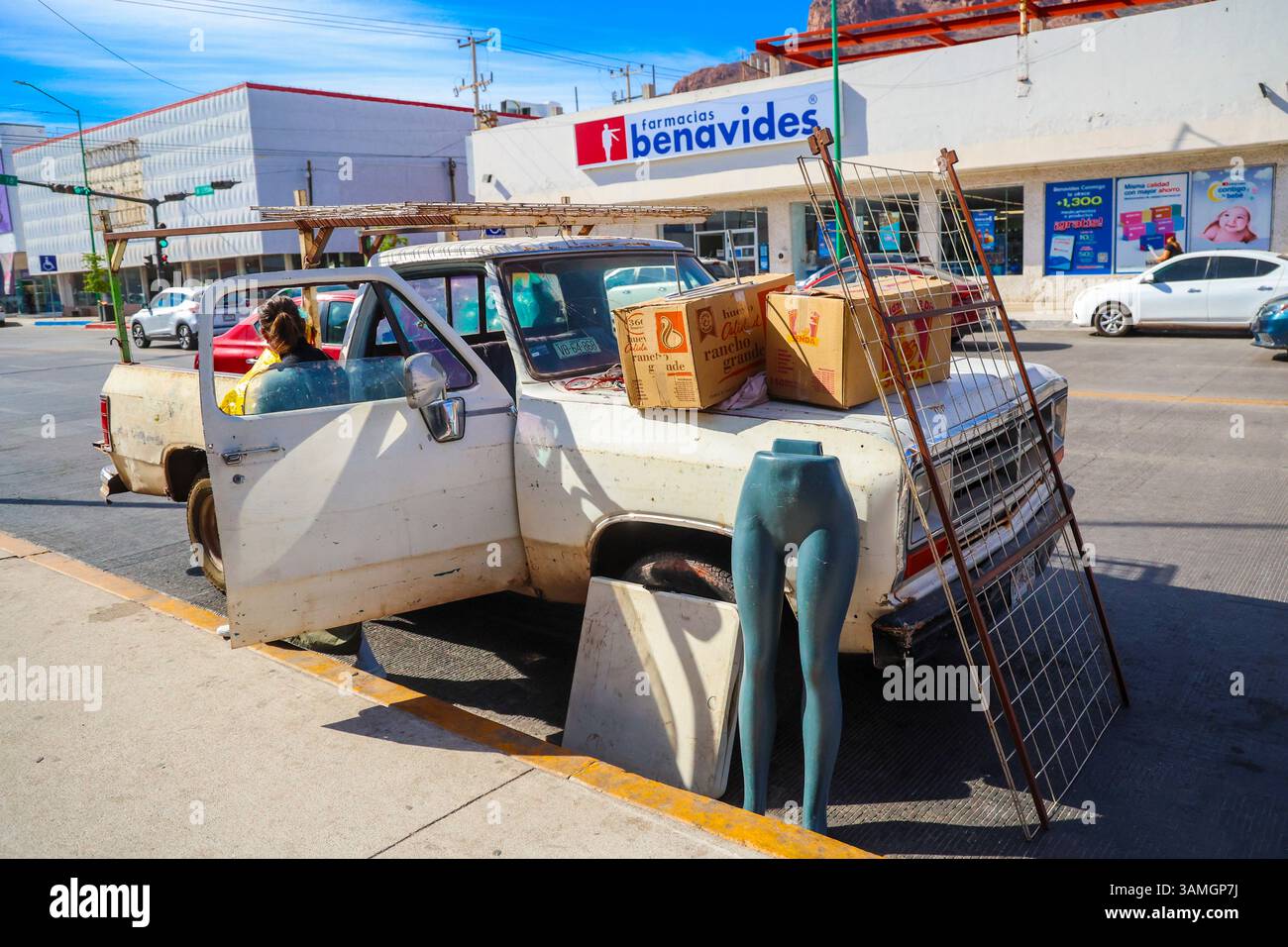 Mannequin leaning against an old pickup truck on Serdan Street in ...