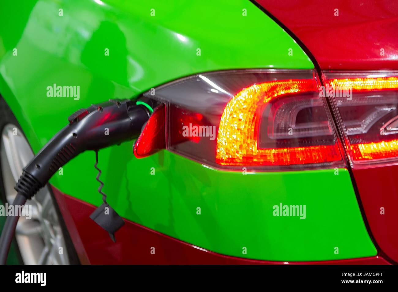 Modern electric car getting electricity from renewable energy sources ...