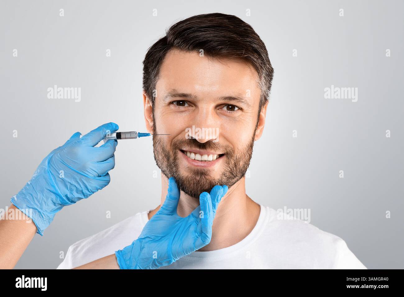 Unrecognizable cosmetician injecting face hi-res stock photography and ...