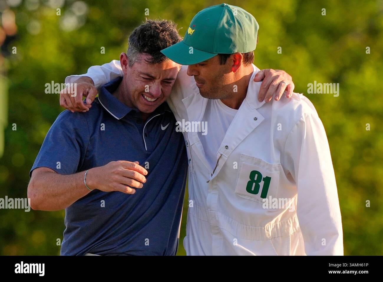 Rory McIlroy, of Northern Ireland, hugs caddie Harry Diamond, right ...