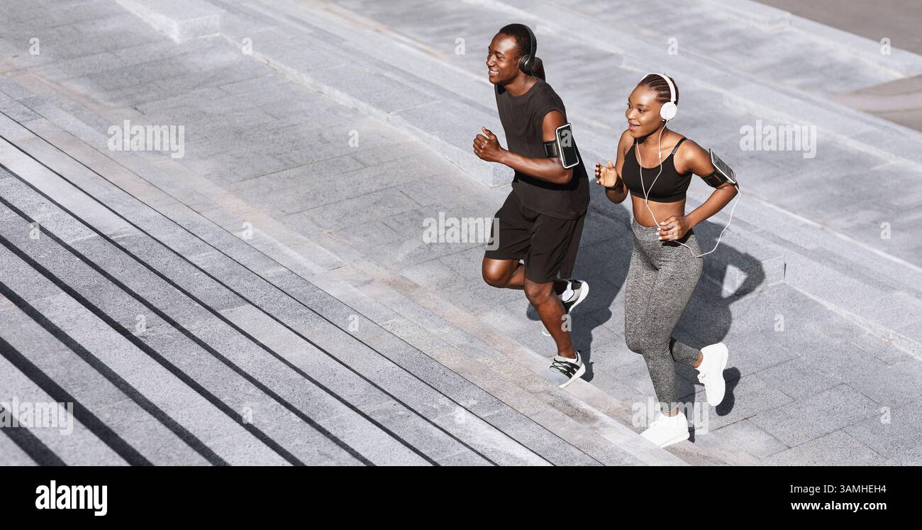 Black Man And Woman Jogging Together In Urban Park, Running Up Steps ...