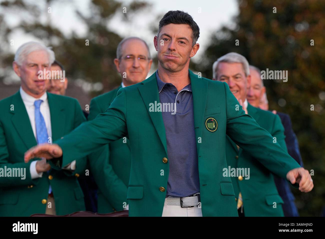 Rory McIlroy, of Northern Ireland, celebrates after putting on the ...