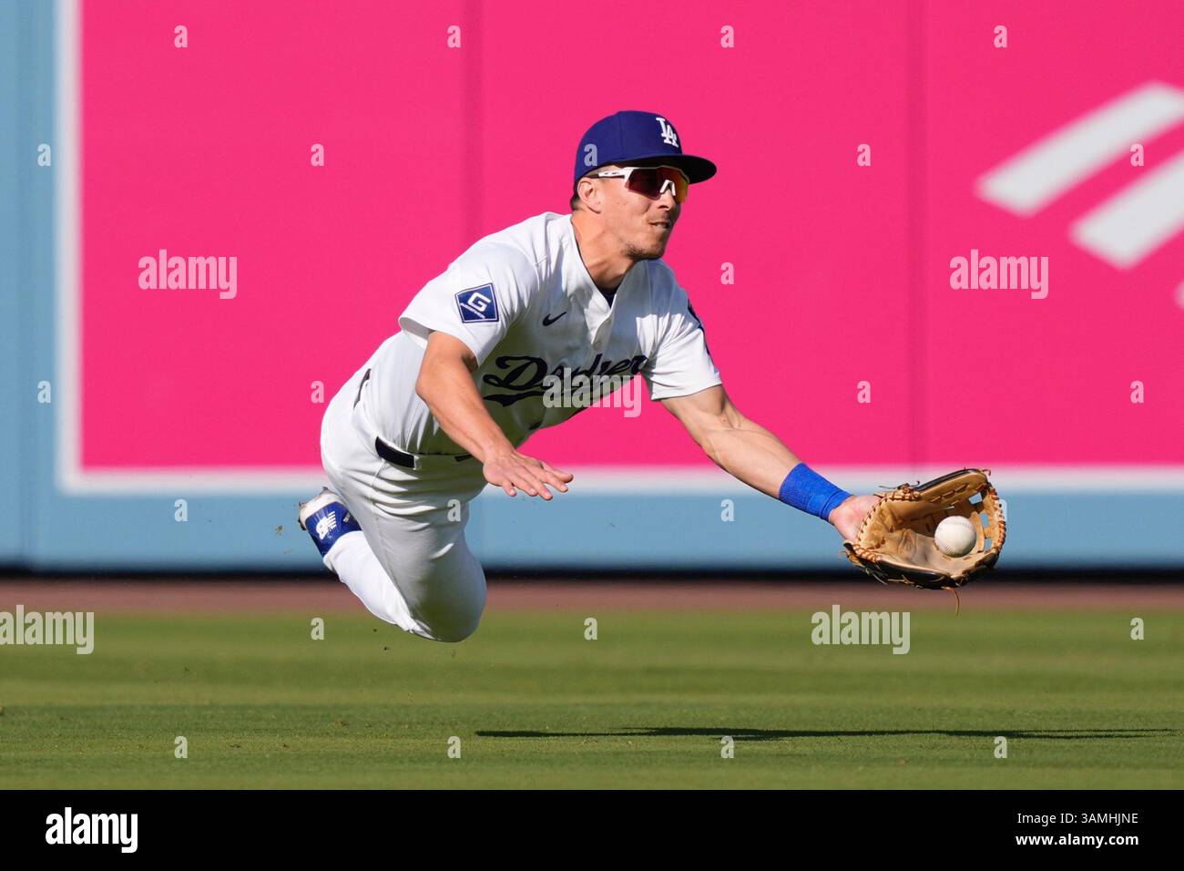 Los Angeles Dodgers center fielder Tommy Edman makes a catch on a ball ...