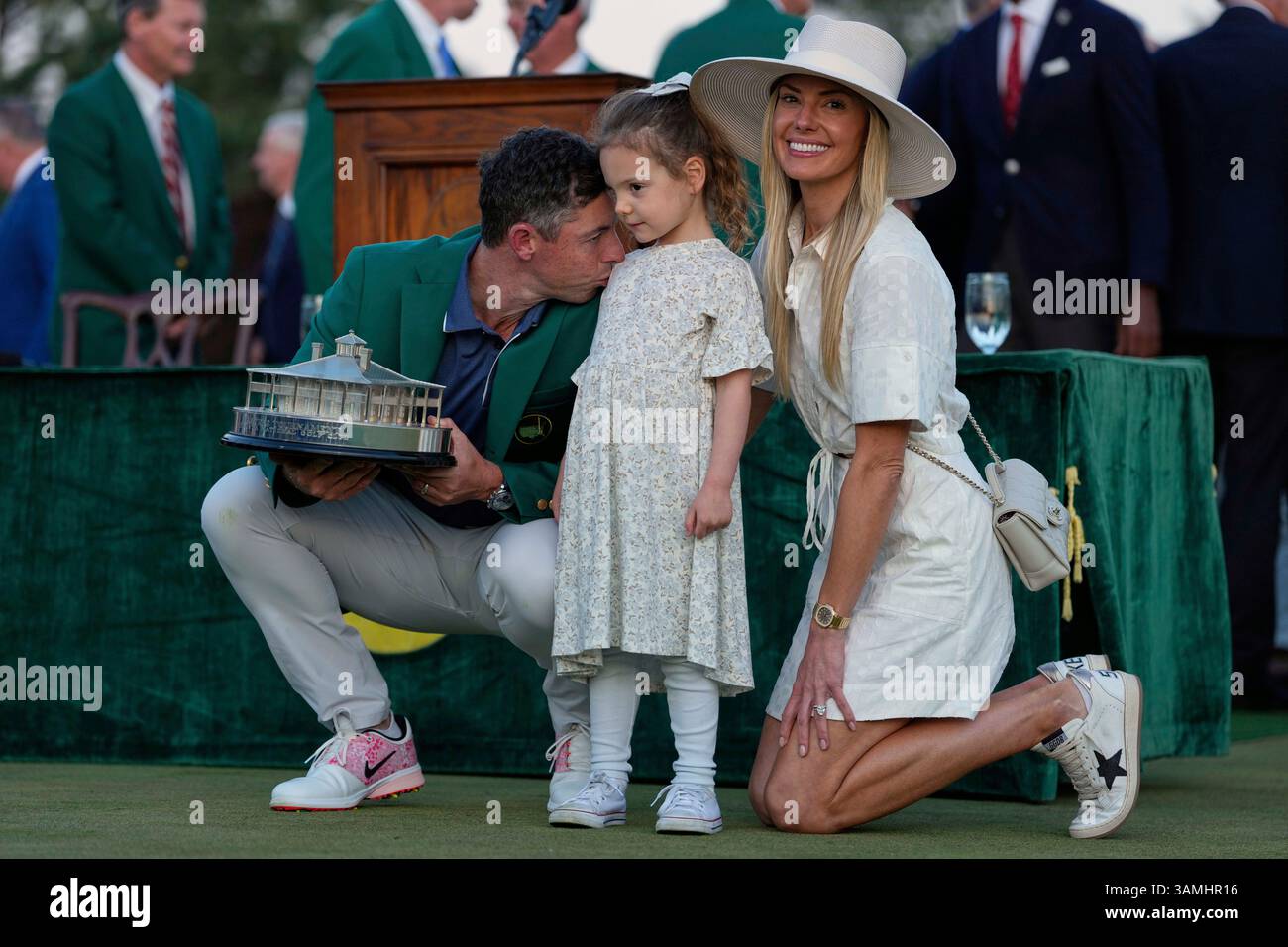 Rory McIlroy, of Northern Ireland, with his wife Erica Stoll, kisses ...