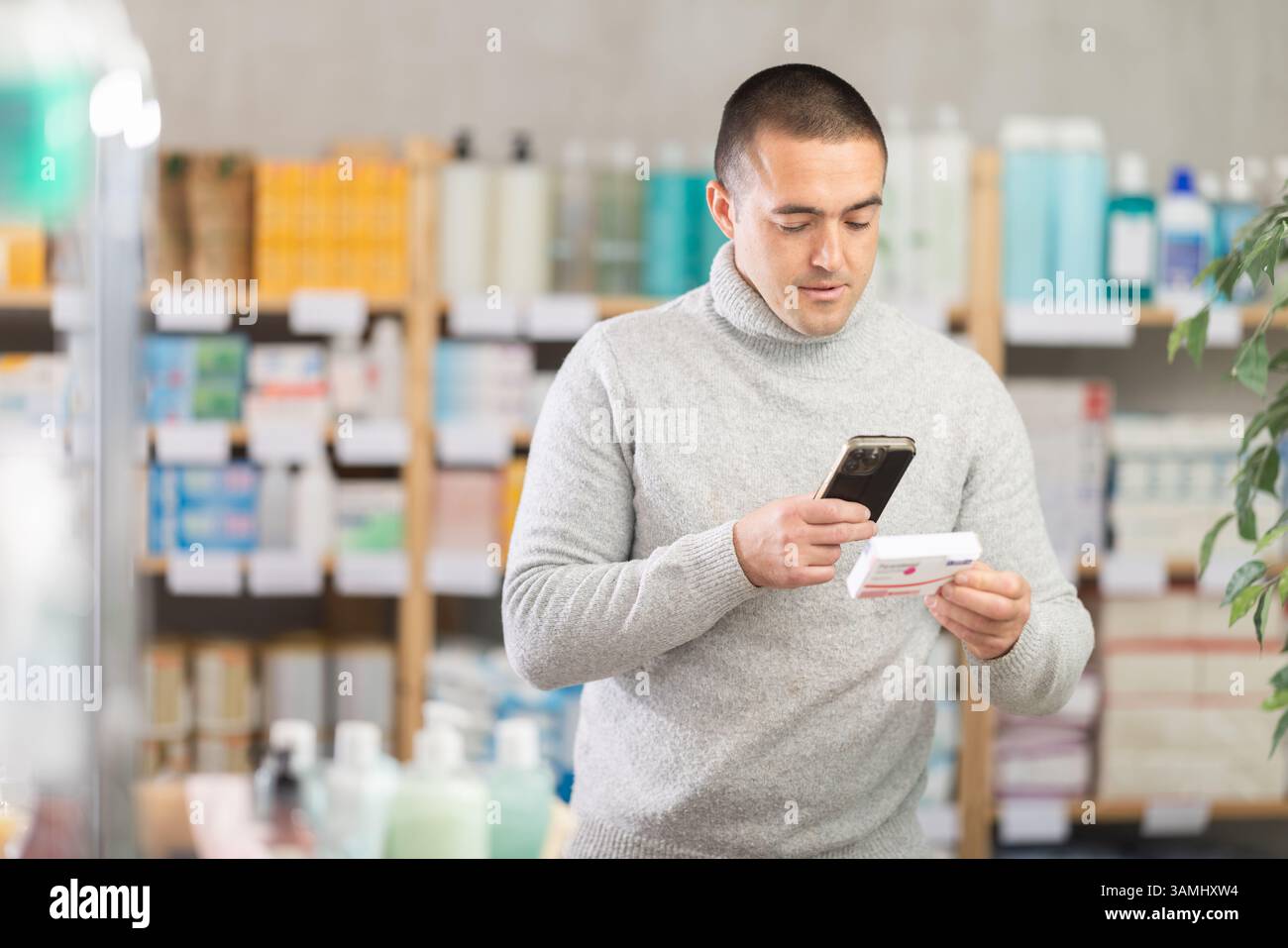 Man scans code on package of paracetamol pills to check expiration date ...