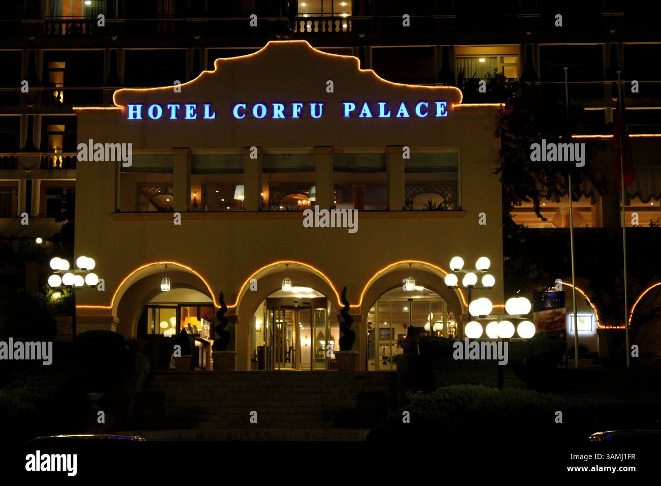 Corfu Palace Hotel illuminated at night, Garitsa Bay, Corfu, Greece ...