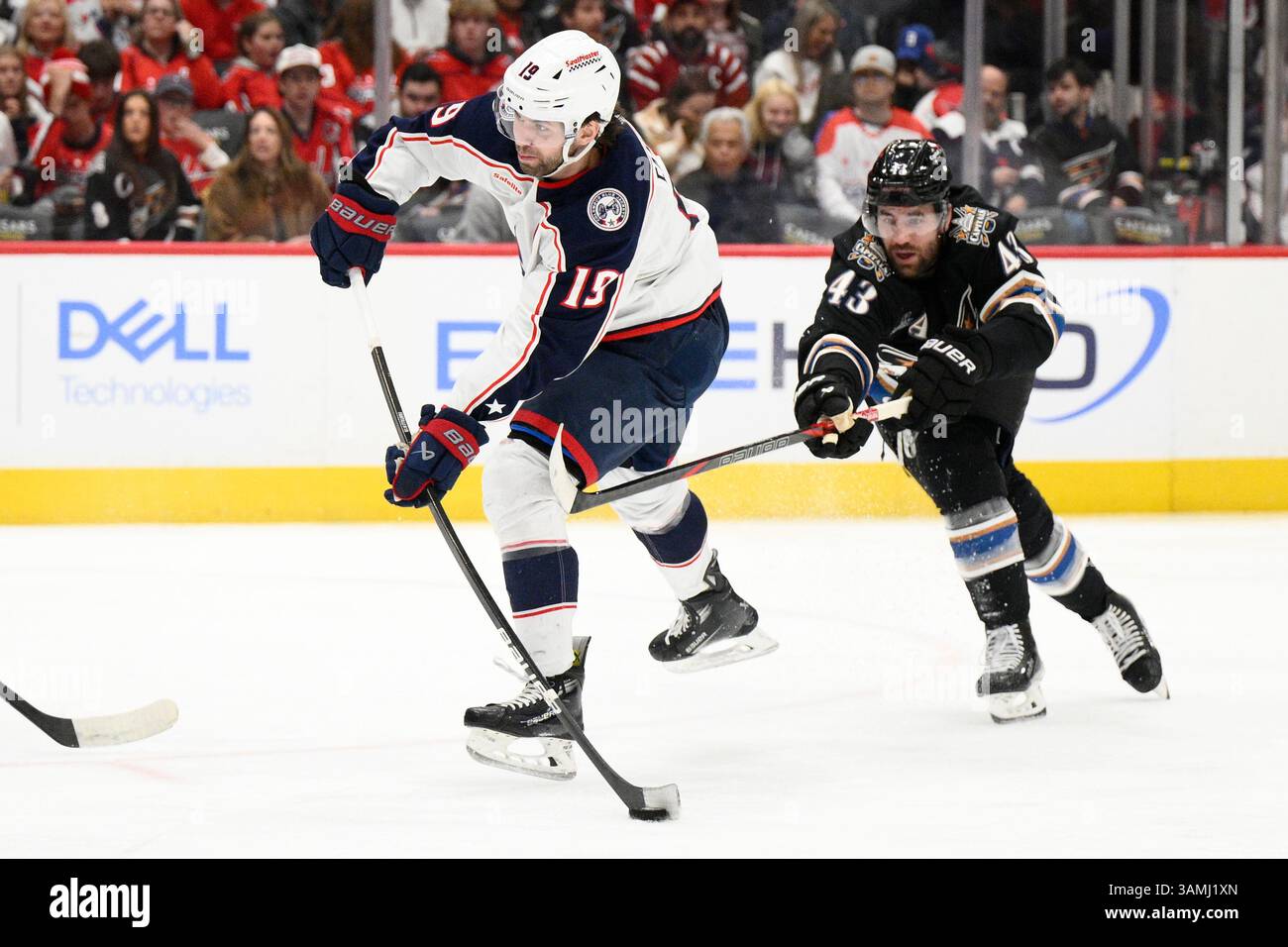 Columbus Blue Jackets center Adam Fantilli (19) shoots the puck past ...