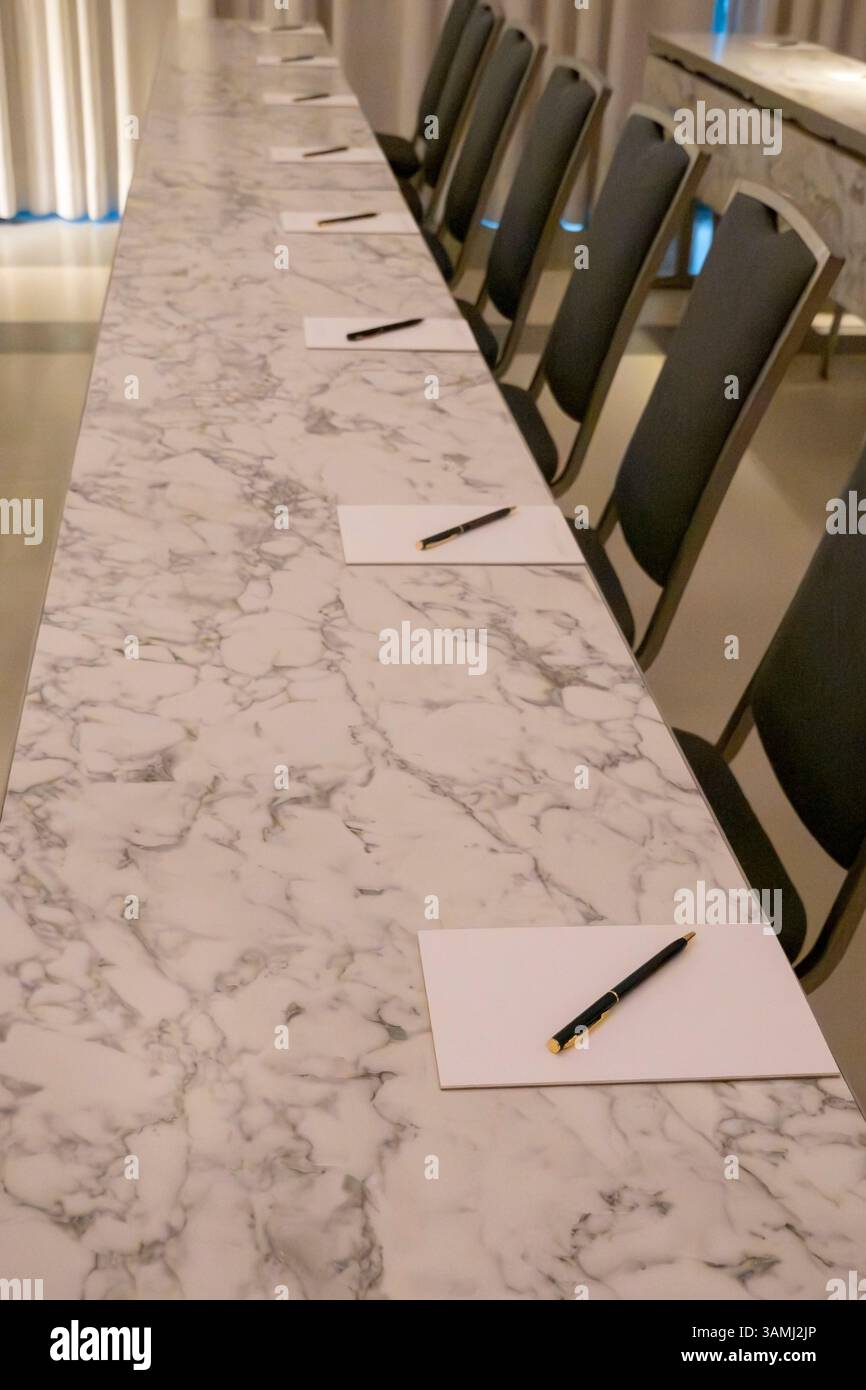 Empty conference room with paper and pens Stock Photo - Alamy