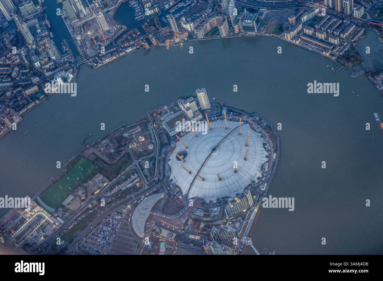 Aerial view of London through early morning clouds with Thames river ...