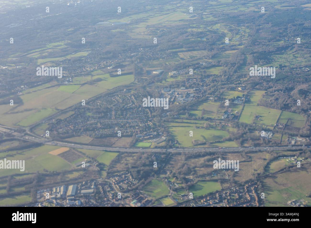 Aerial view of London outskirts suburbs from an aeroplane window, UK ...