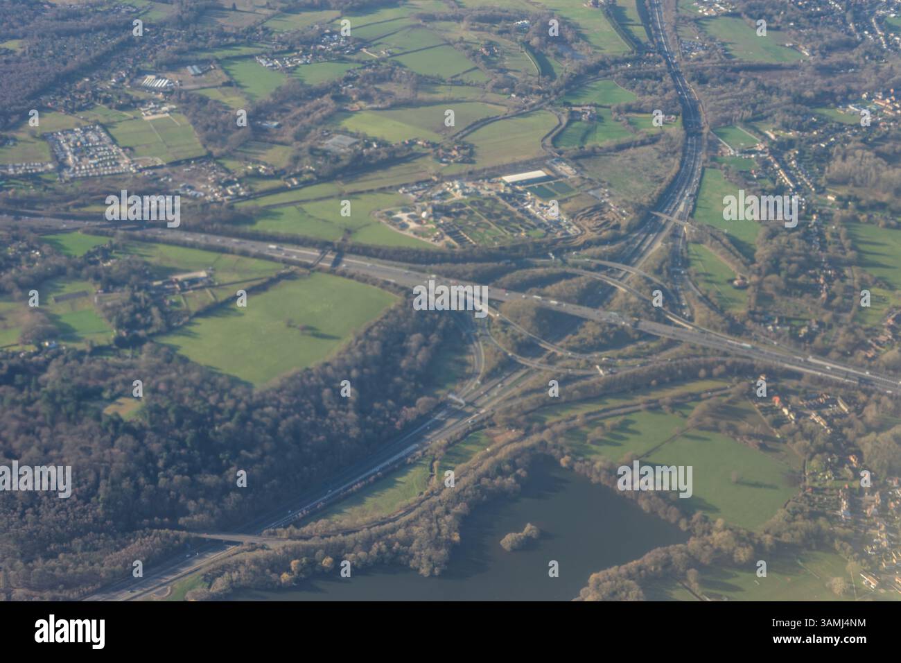 Aerial view of London outskirts suburbs from an aeroplane window, UK ...