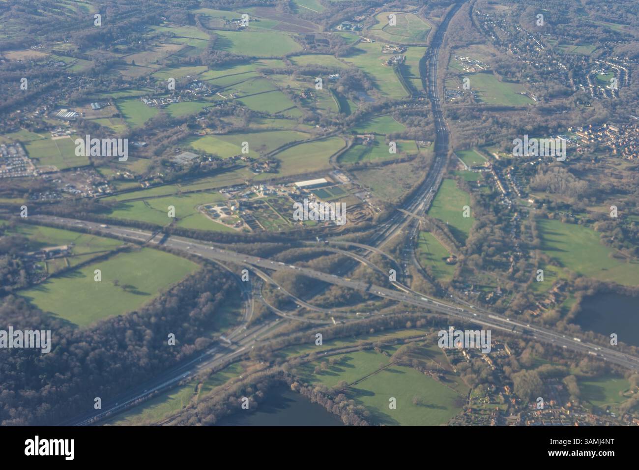 Aerial view of London outskirts suburbs from an aeroplane window, UK ...
